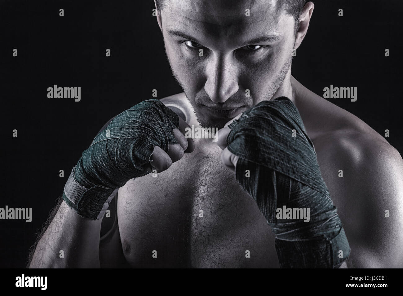 Boxing man ready to fight. Boxer with strong hands and clenched fists ...