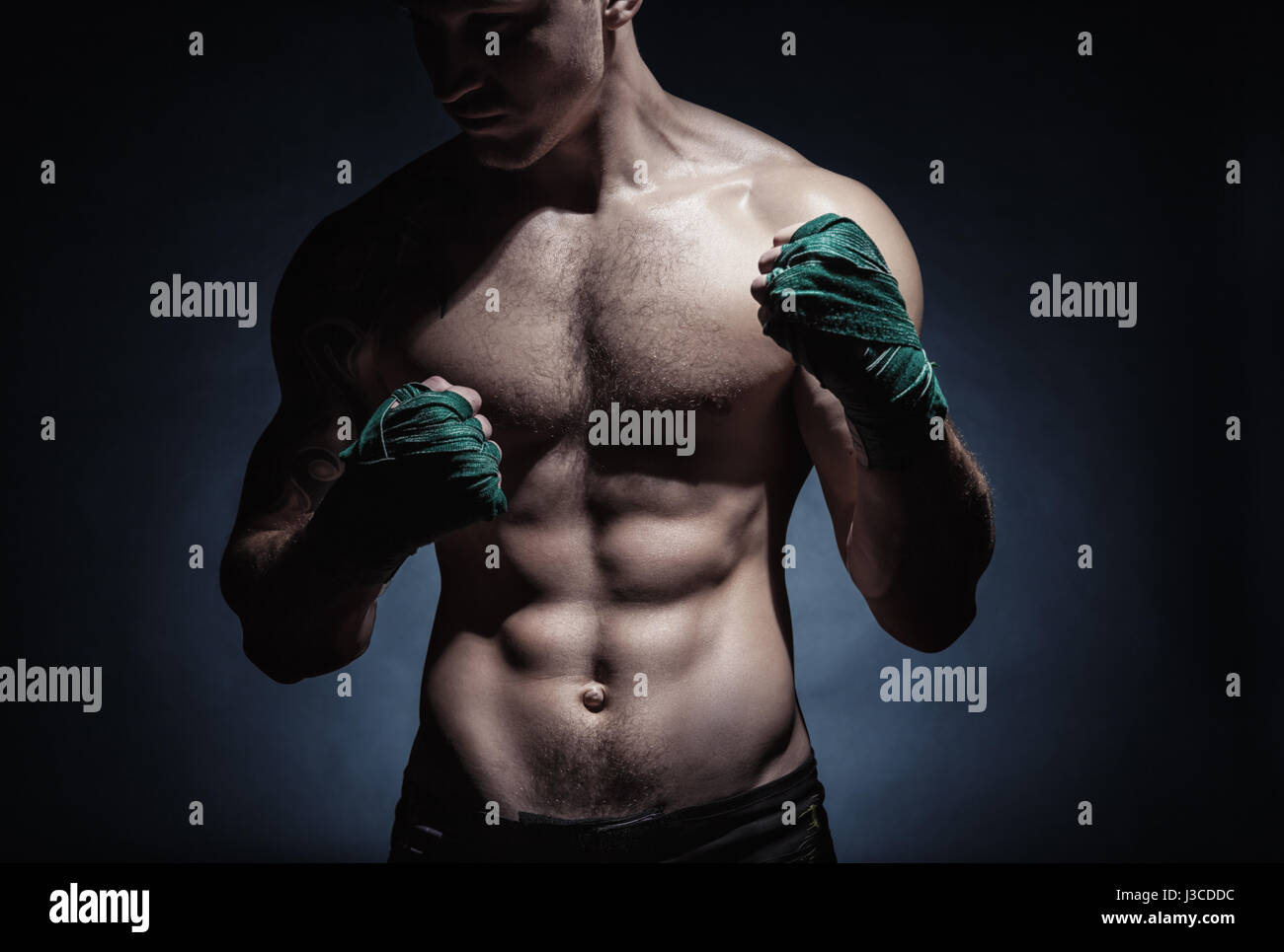 Boxing man ready to fight. Boxer with strong hands and clenched fists ...
