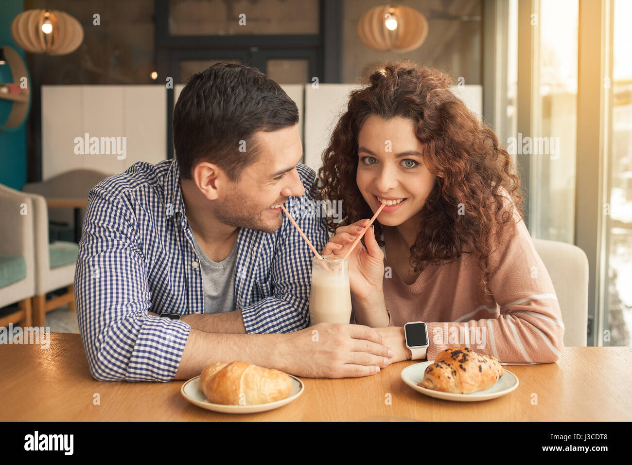 Nice looking couple in cafe Stock Photo - Alamy