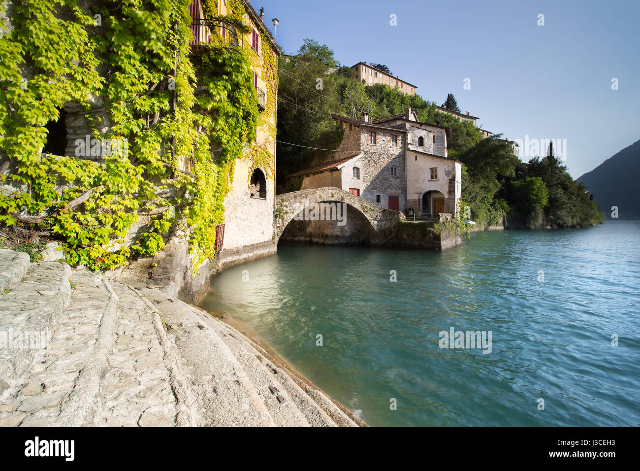 Old stone bridge at the end of Nesso's ravine, Como, Italy Stock Photo ...