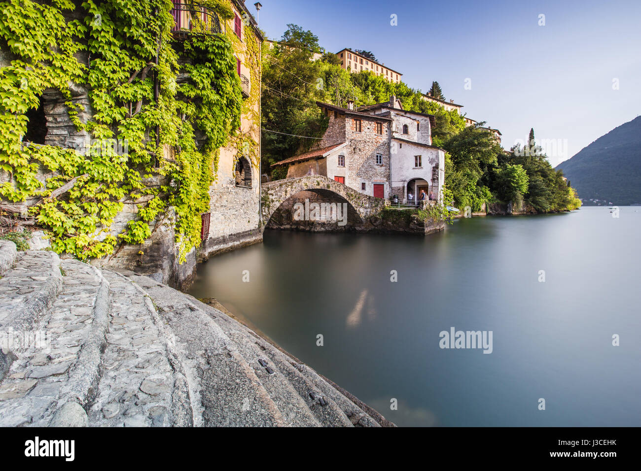 Old stone bridge at the end of Nesso's ravine, Como, Italy Stock Photo ...