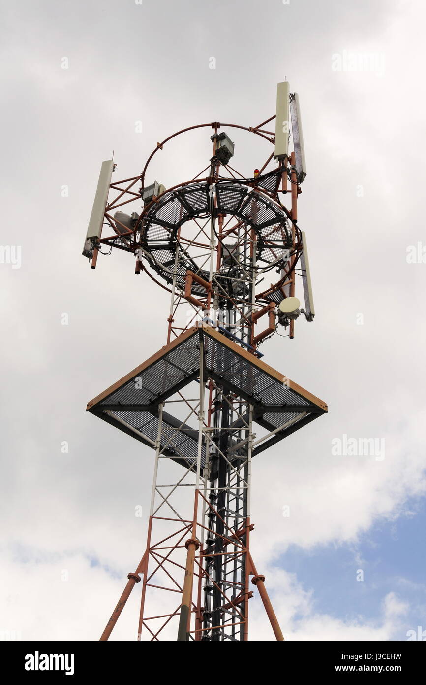 Transmitters and aerials on telecommunication tower during sunset Stock Photo - Alamy
