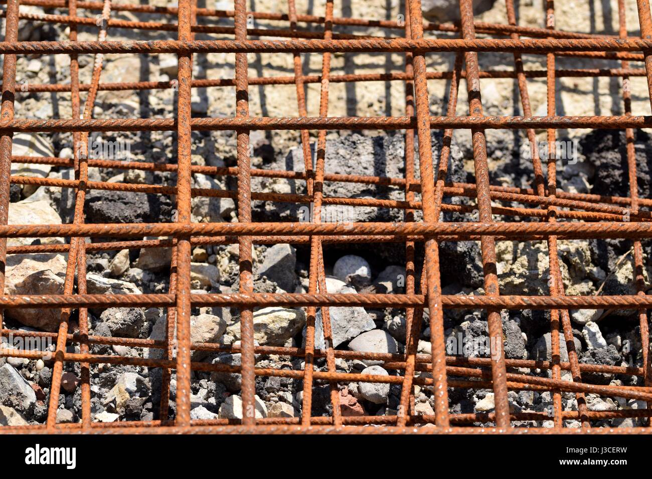 Rusty steel construction with concrete and asphalt pieces in the ...