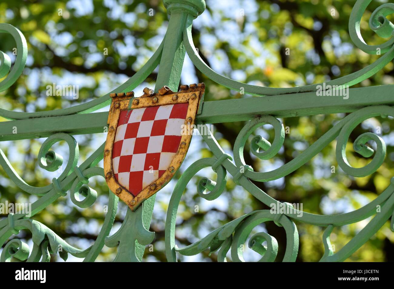 Old Croatian coat of arms placed on the top of decorated metal fence ...