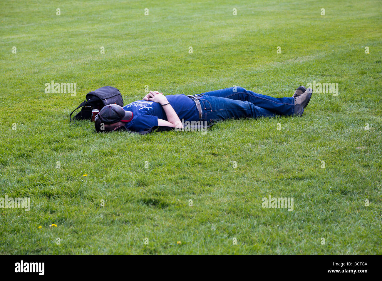 Man asleep in public park Stock Photo - Alamy