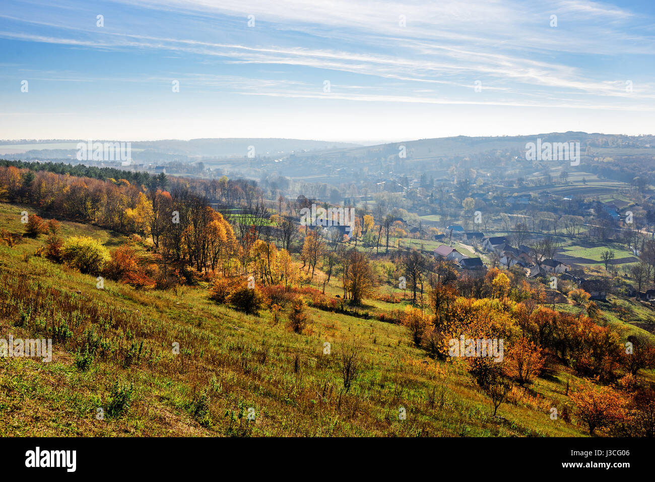 Colorfull trees on a hill. Autumnal landscape Stock Photo - Alamy