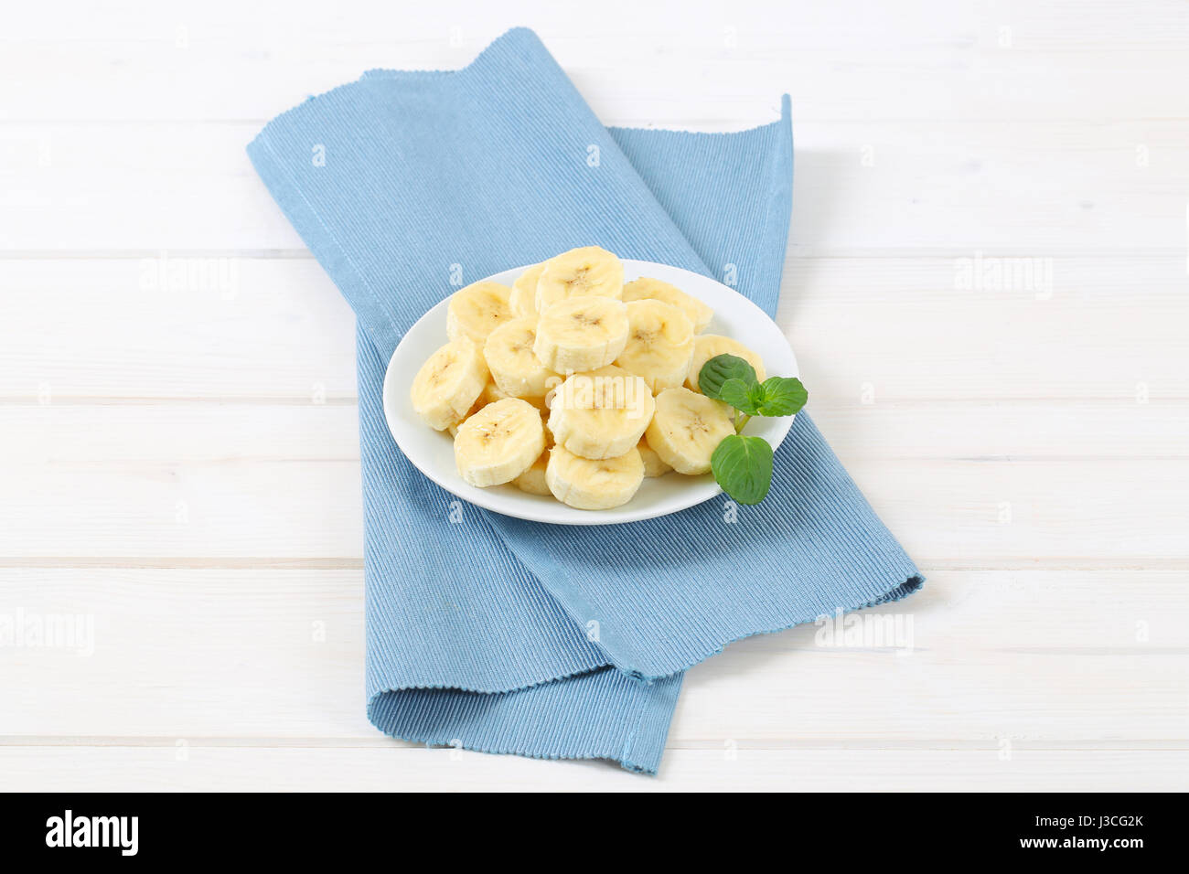 Peeled banana on blue hi-res stock photography and images - Alamy