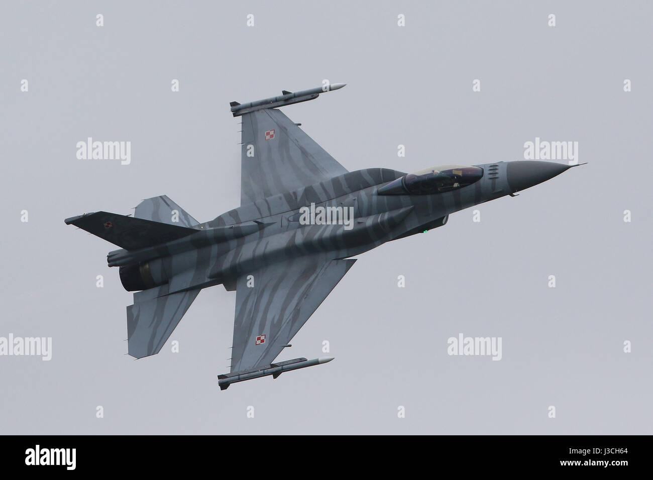 An F16 Falcon Military jet in flight at an airshow Stock Photo - Alamy