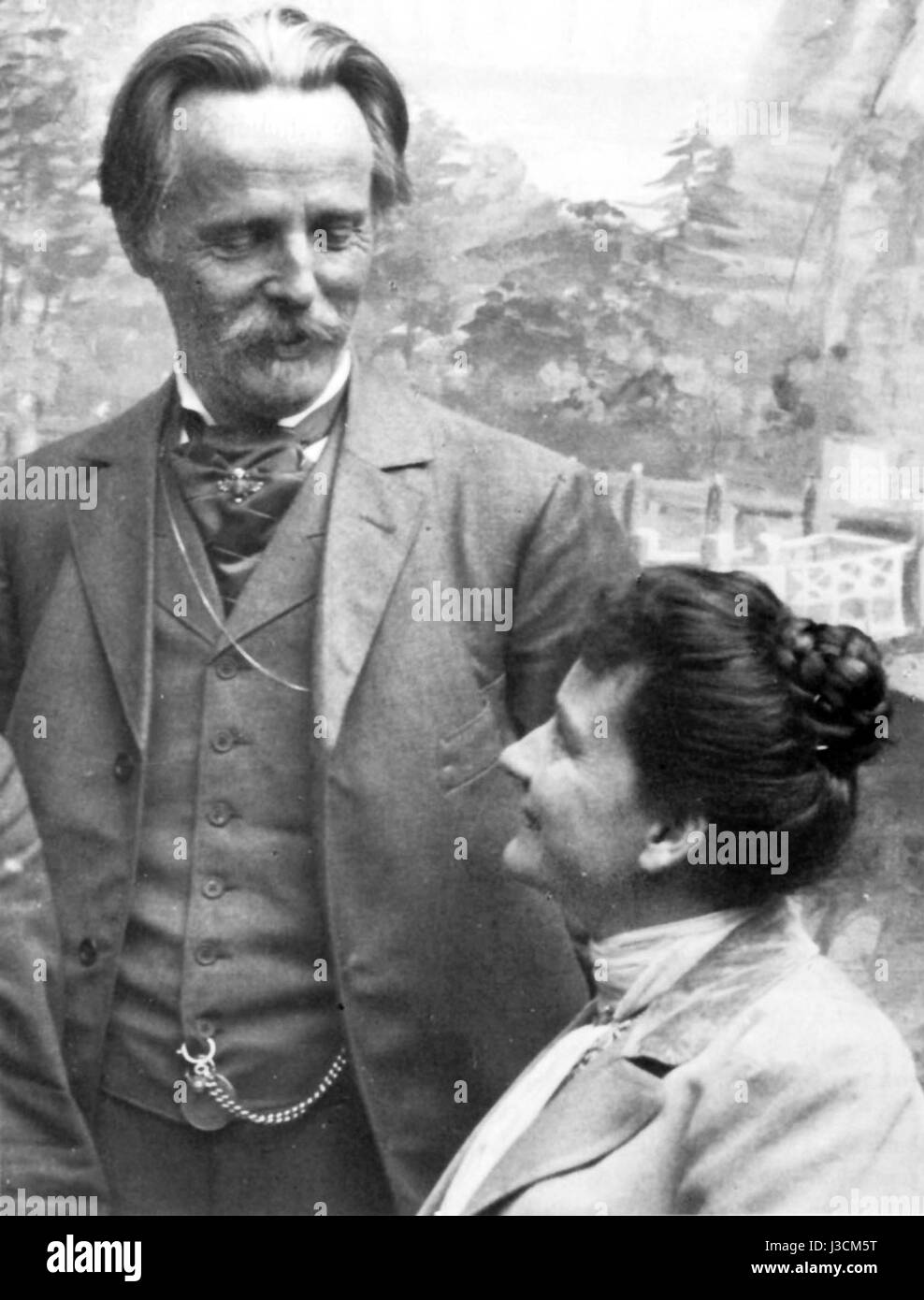 This image depicts an early 20th-century photograph of a married couple ...