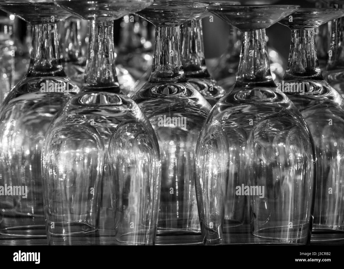 Reflection patterns on upside down water goblets monochrome Stock Photo ...