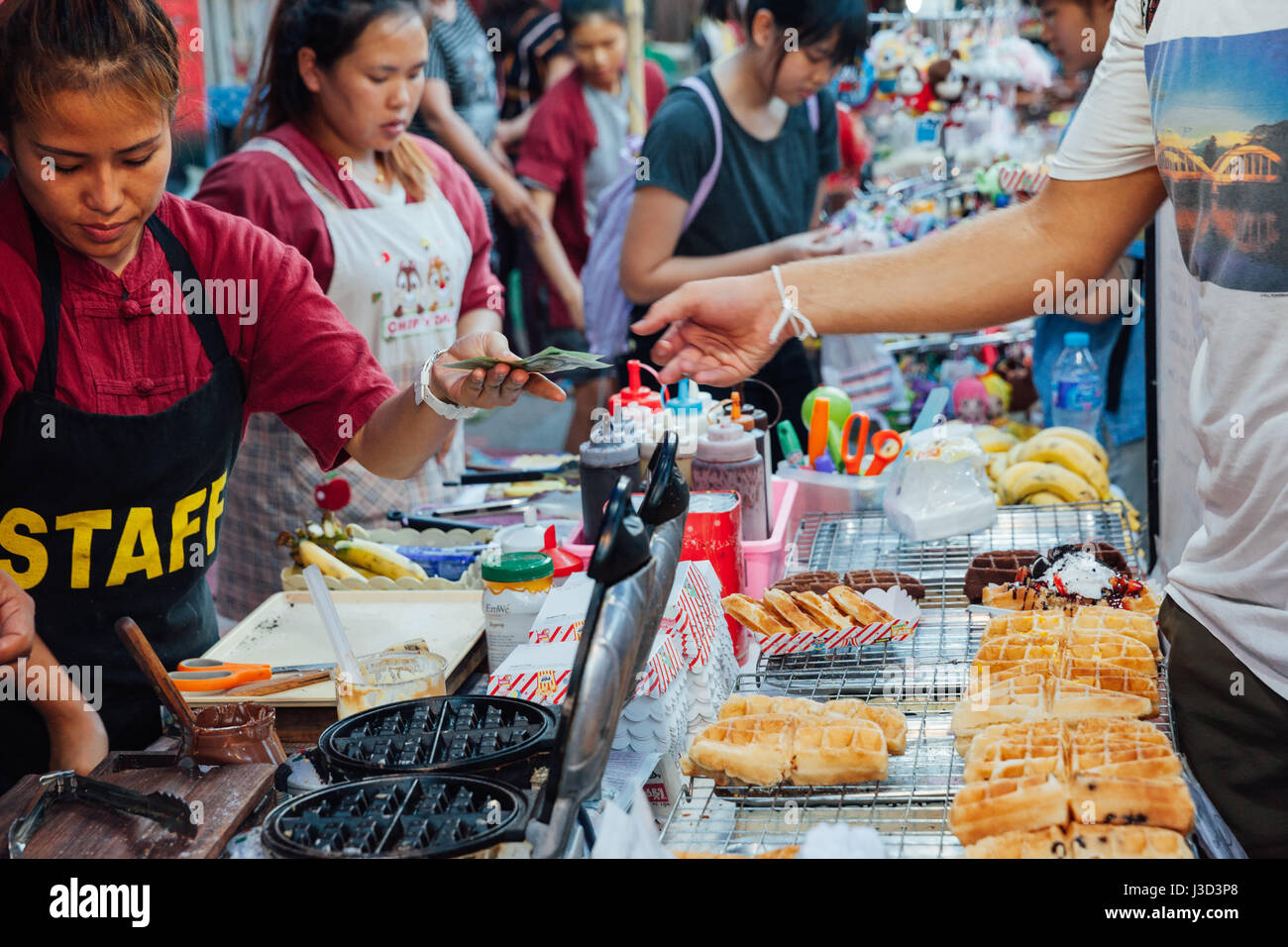 CHIANG MAI, THAILAND - AUGUST 21: Thai woman sells waffles at the ...