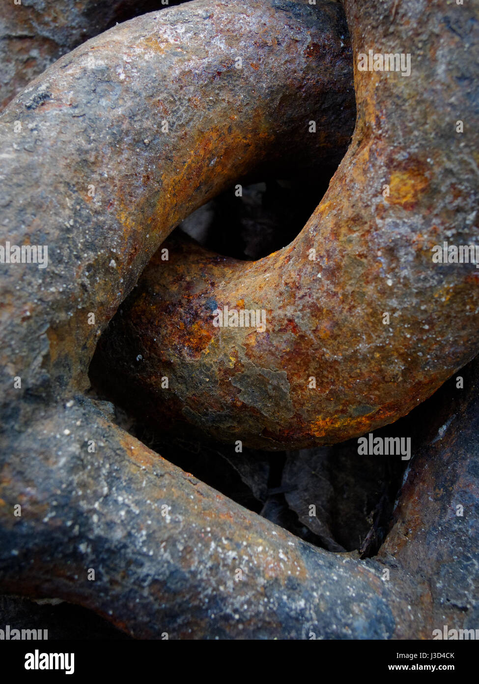 Backgrounds and textures: links of old black rusty chain, close-up shot ...