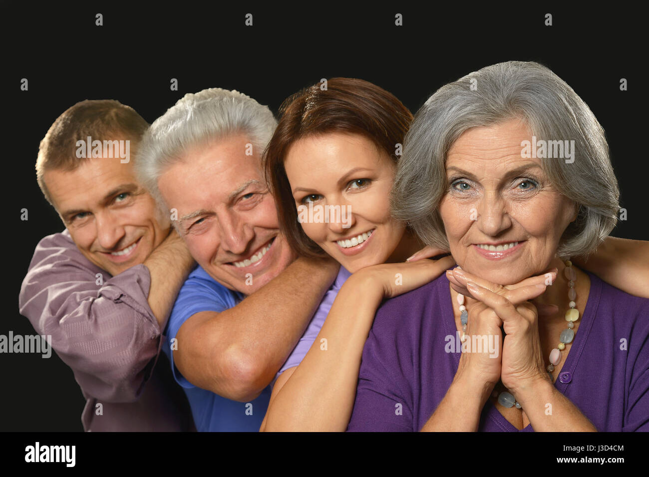 Happy parents with grown-up children Stock Photo - Alamy