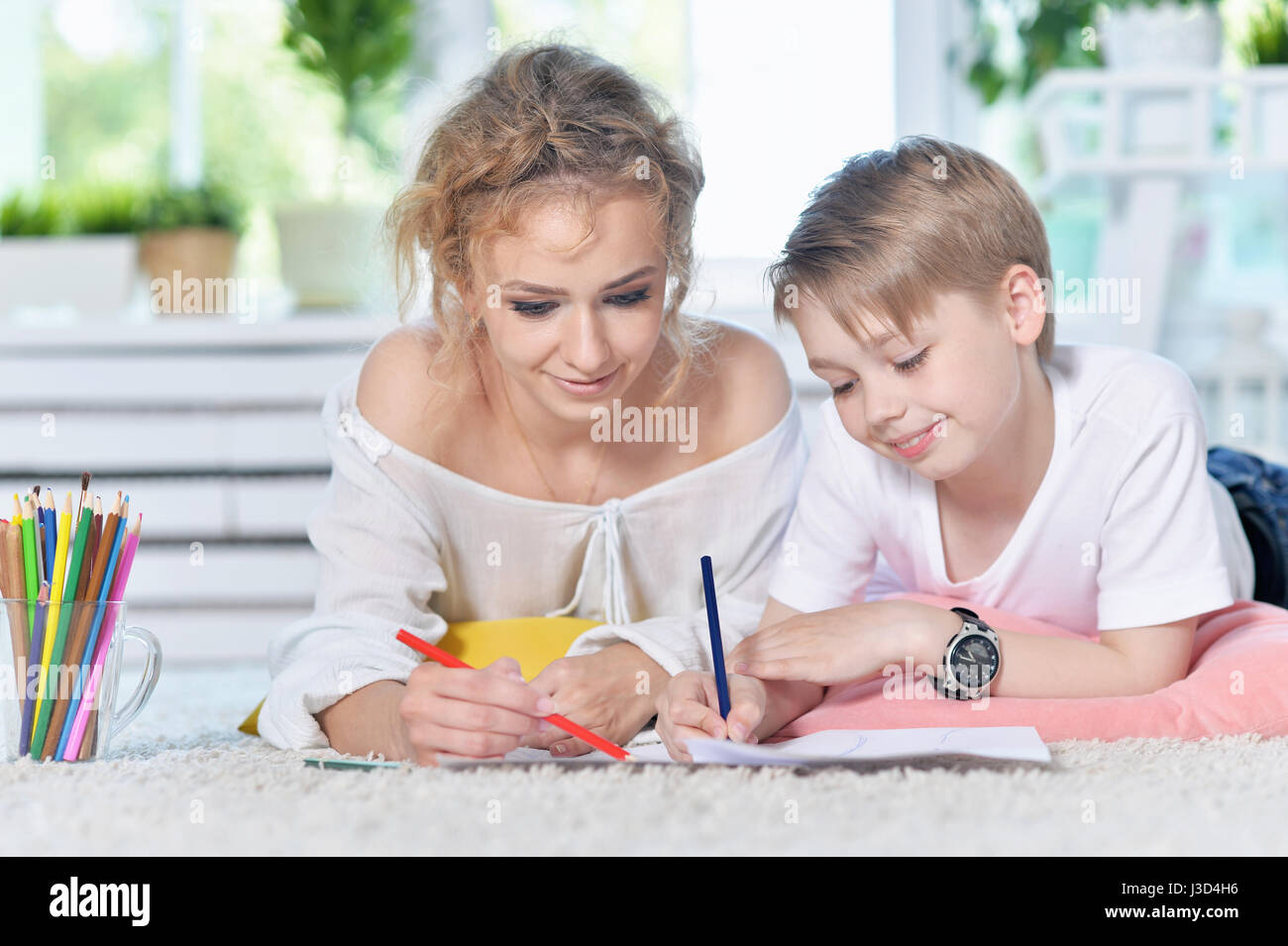 Mom and son doing lessons Stock Photo - Alamy
