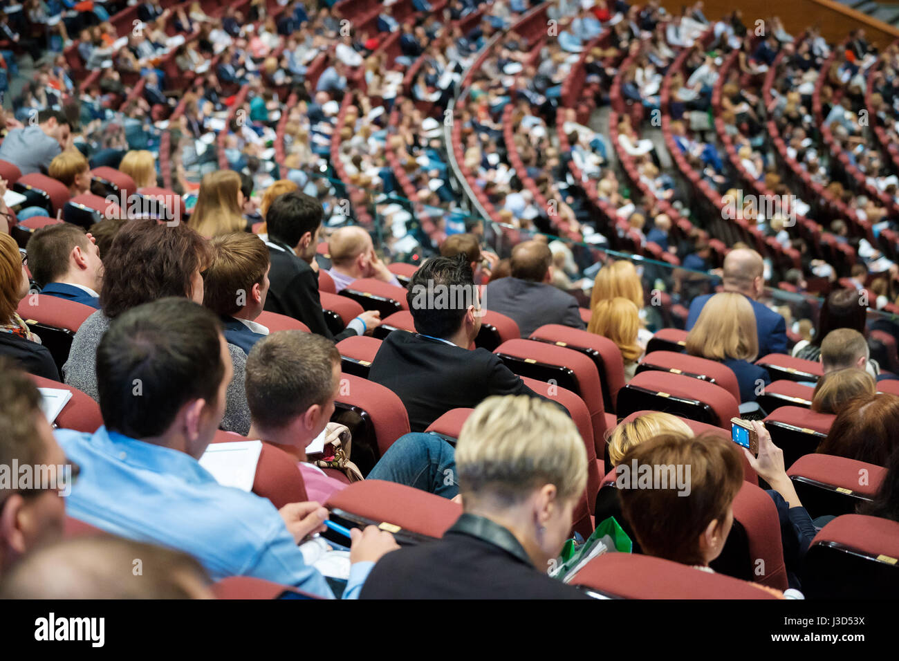 Audience at conference hall Stock Photo - Alamy