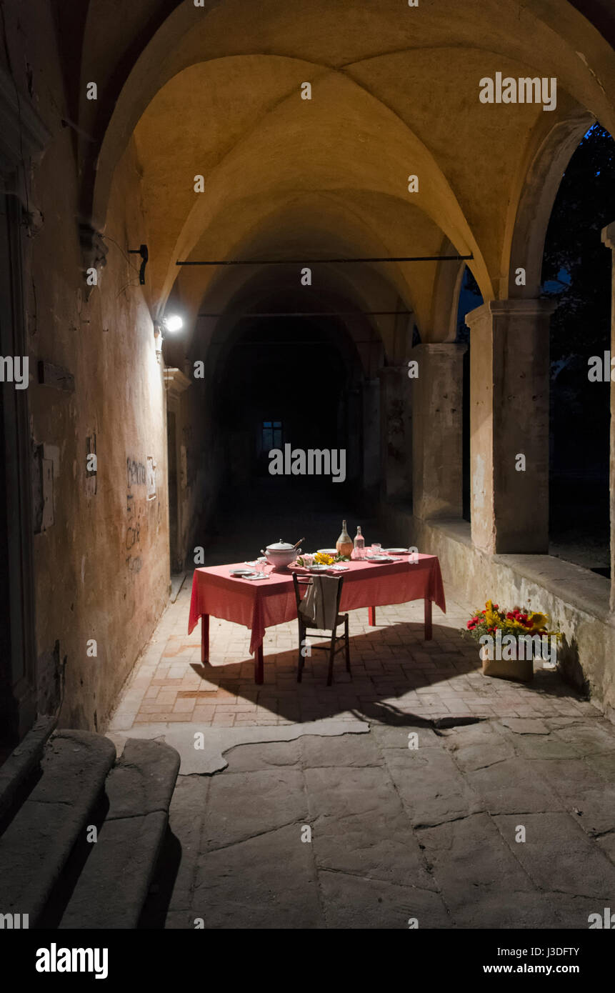 View of laid table inside a cloister Stock Photo - Alamy