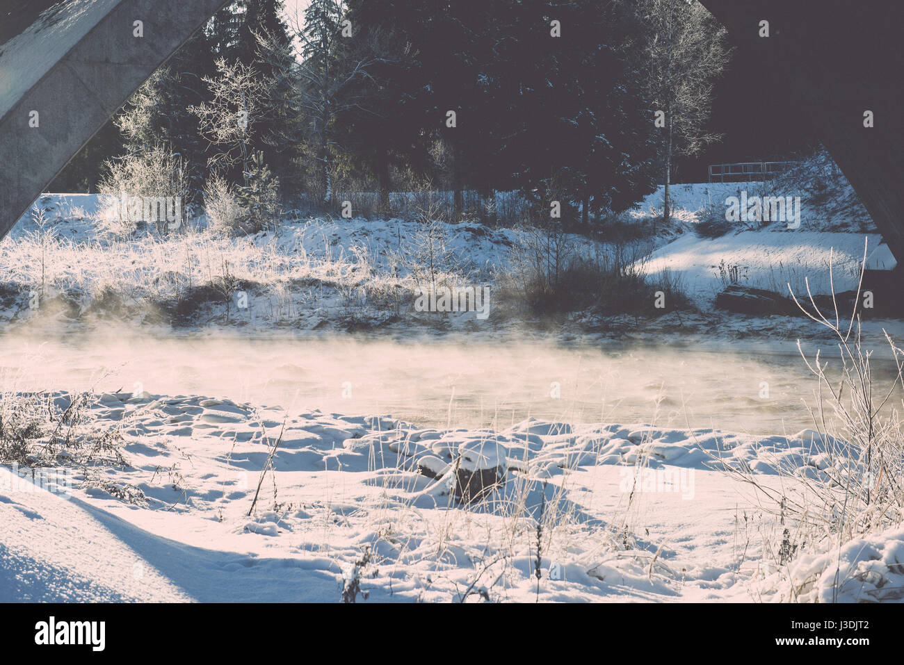 snowy winter river landscape with snow covered trees and blue sky ...