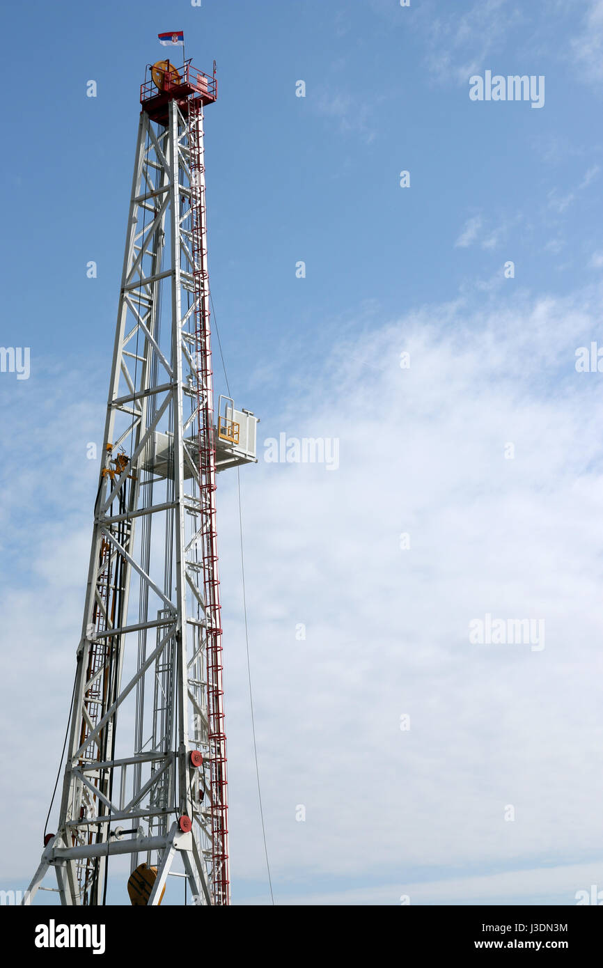 oil drilling rig tower on blue sky Stock Photo - Alamy