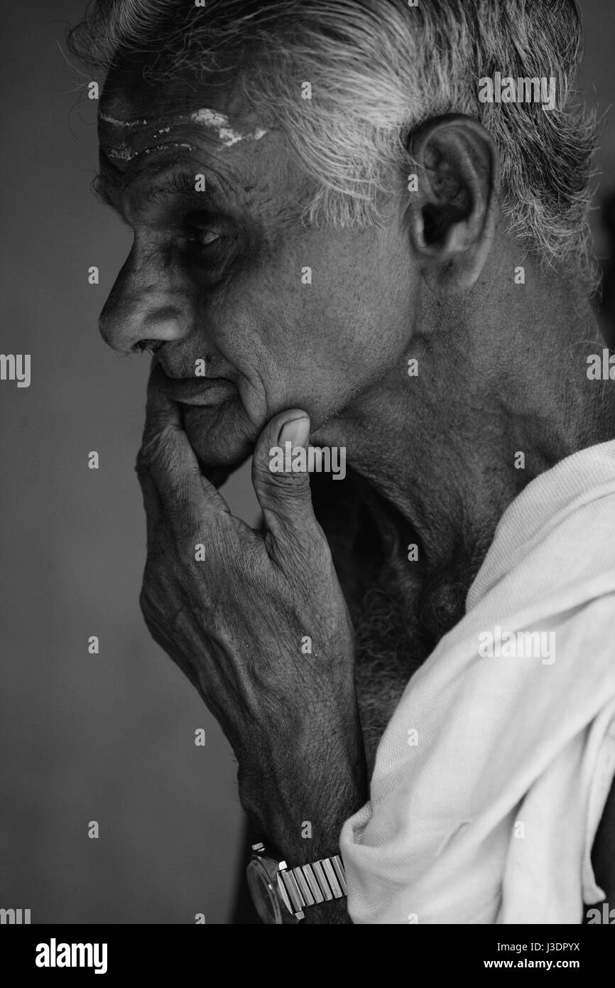 An old man thinking Stock Photo - Alamy