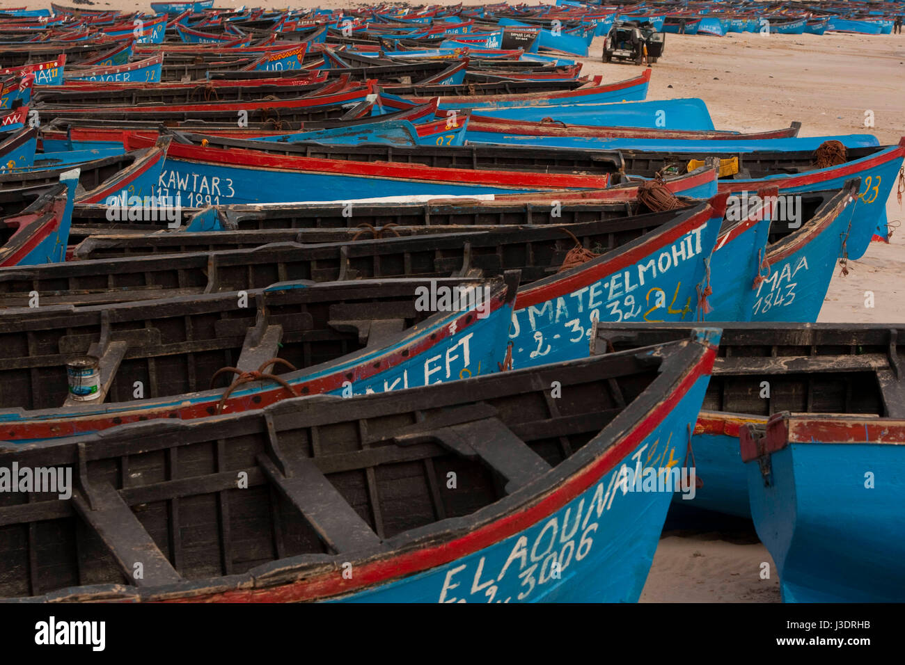 Fishing boats on a beach in Western Sahara Stock Photo - Alamy