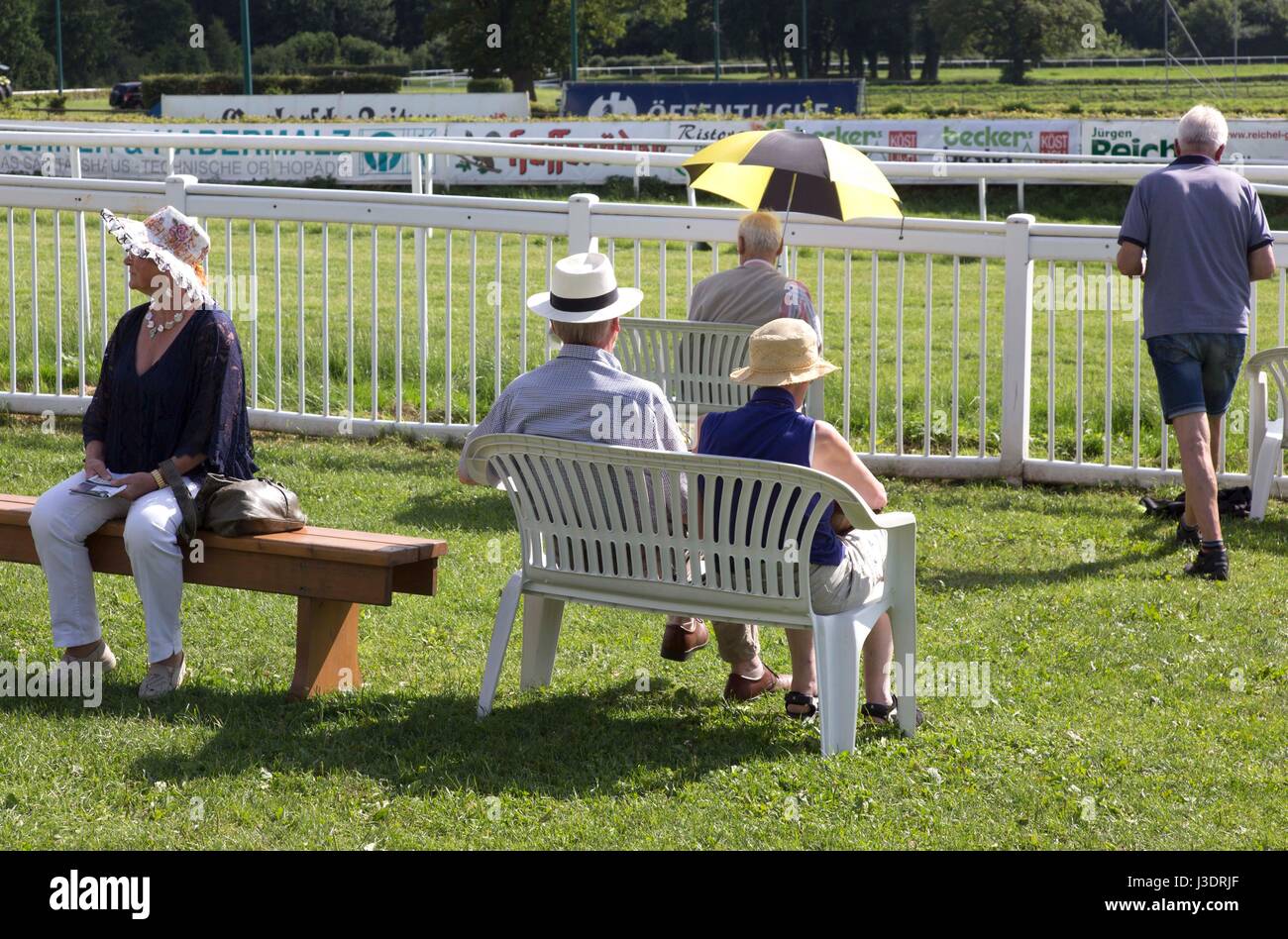 Seniors at the gallop racecourse Stock Photo - Alamy