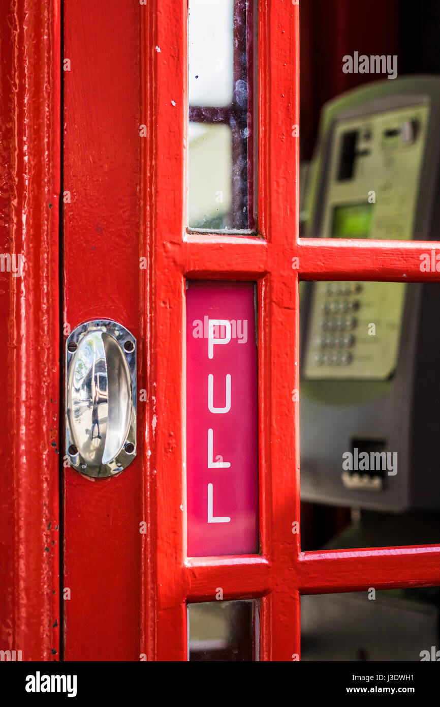 Pull handle on the door of a red telephone box, London, England, U.K ...