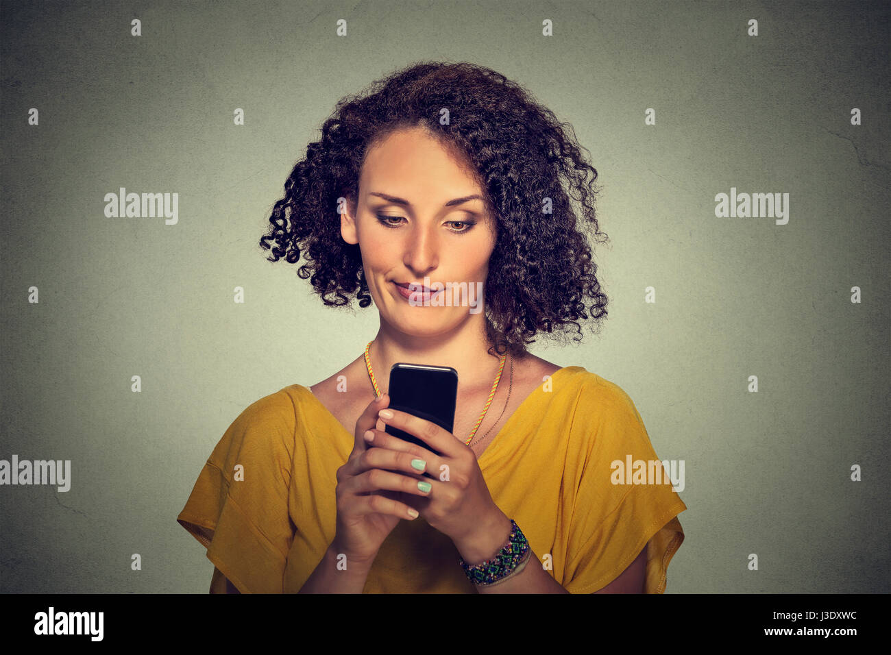 Closeup portrait upset skeptical unhappy serious woman talking texting ... Closeup portrait upset skeptical unhappy serious woman talking texting ...