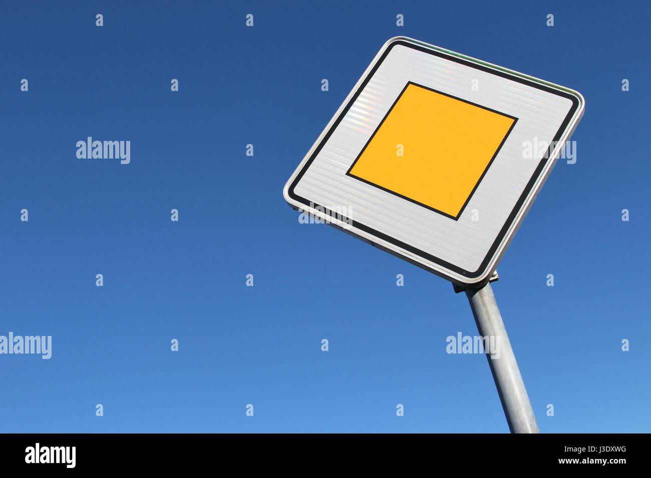 German road sign: priority road Stock Photo - Alamy