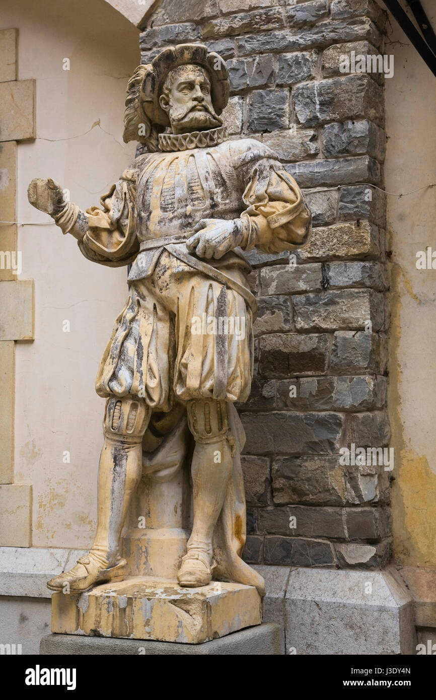 Renaissance style concrete sculpture of a nobleman in the courtyard of ...