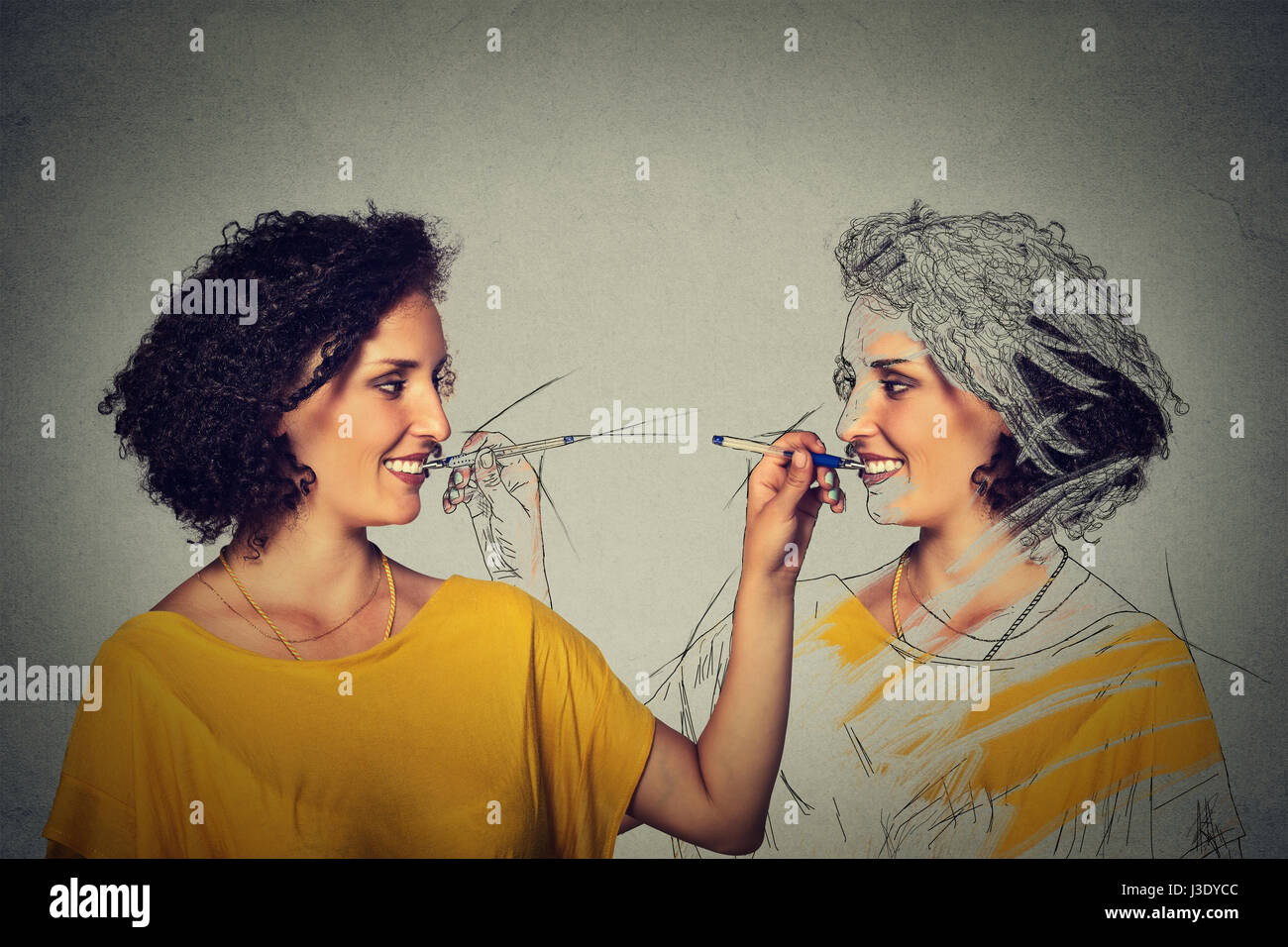 Create yourself, your image concept. Attractive young woman drawing a ...