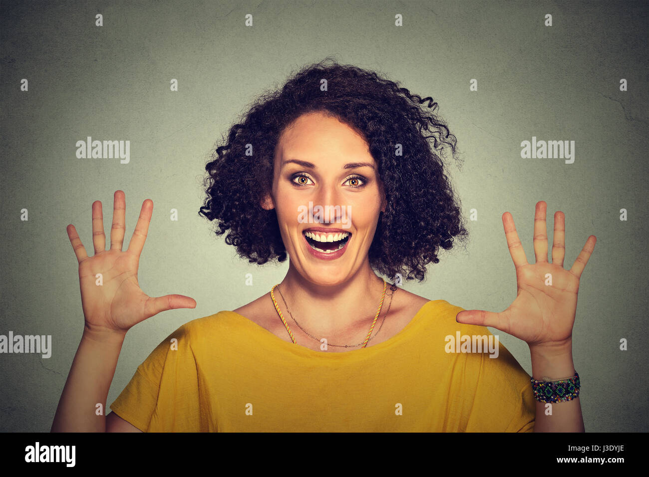 Closeup portrait, headshot happy, smiling young woman making five times ...