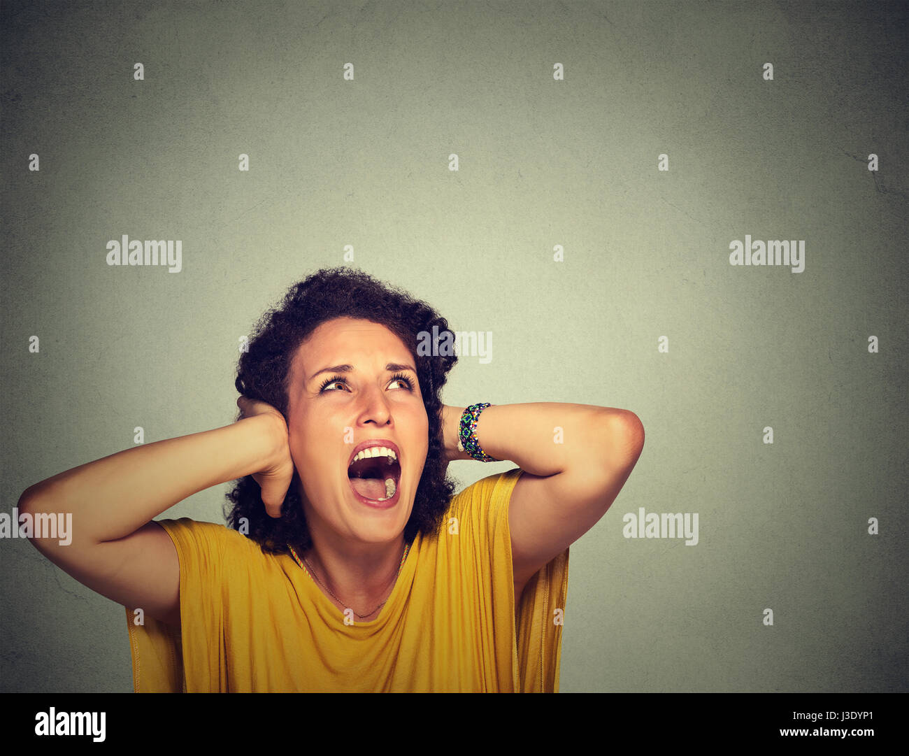Covering ears loud hi-res stock photography and images - Alamy