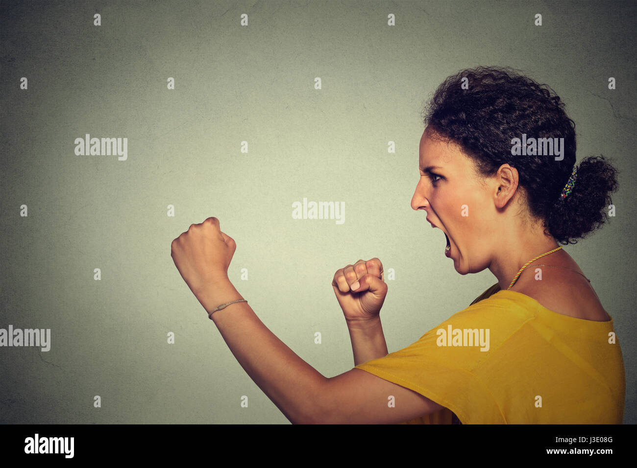 Side profile angry screaming woman Stock Photo - Alamy