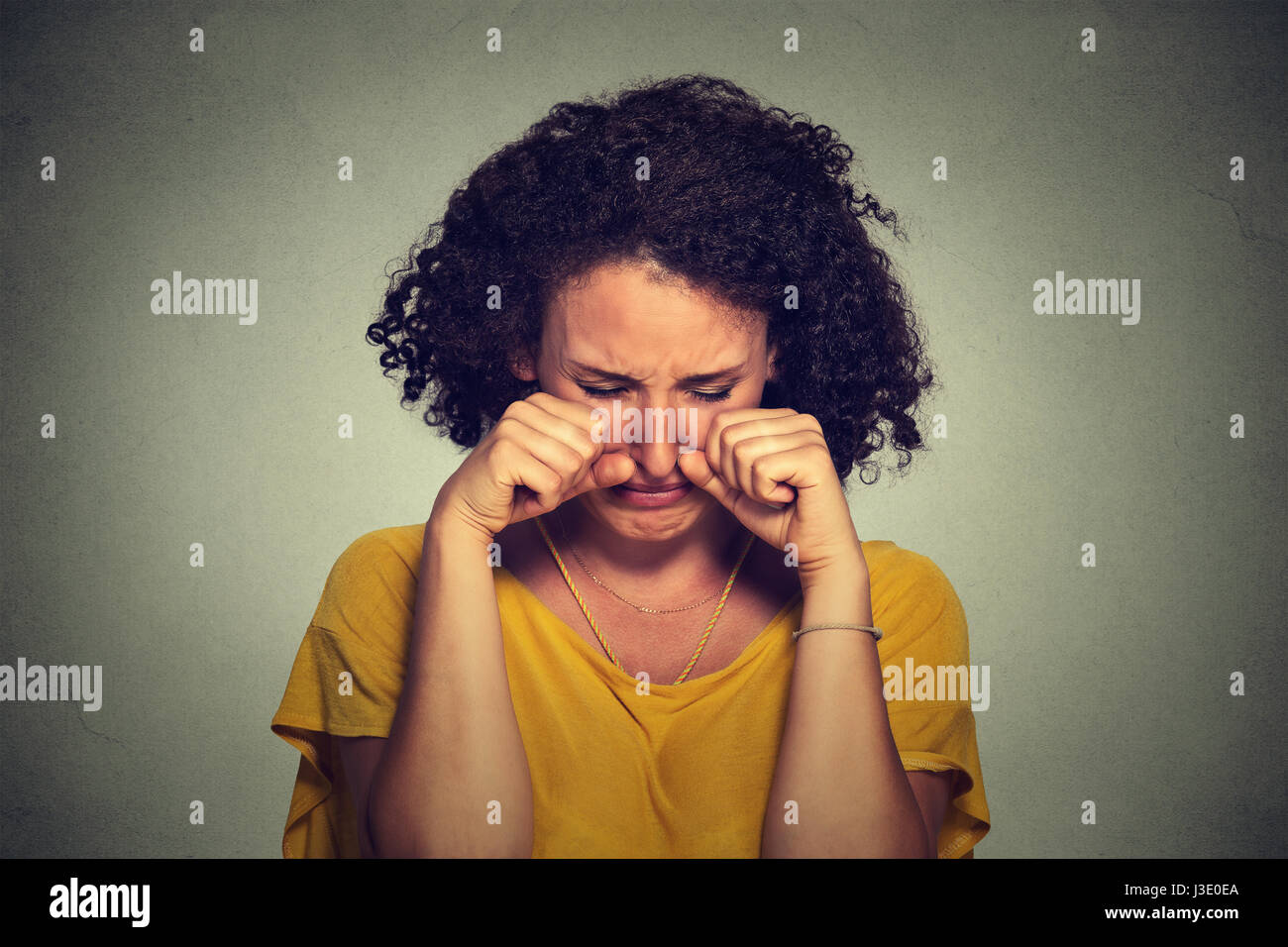 Closeup of a sad beautiful woman crying Stock Photo - Alamy