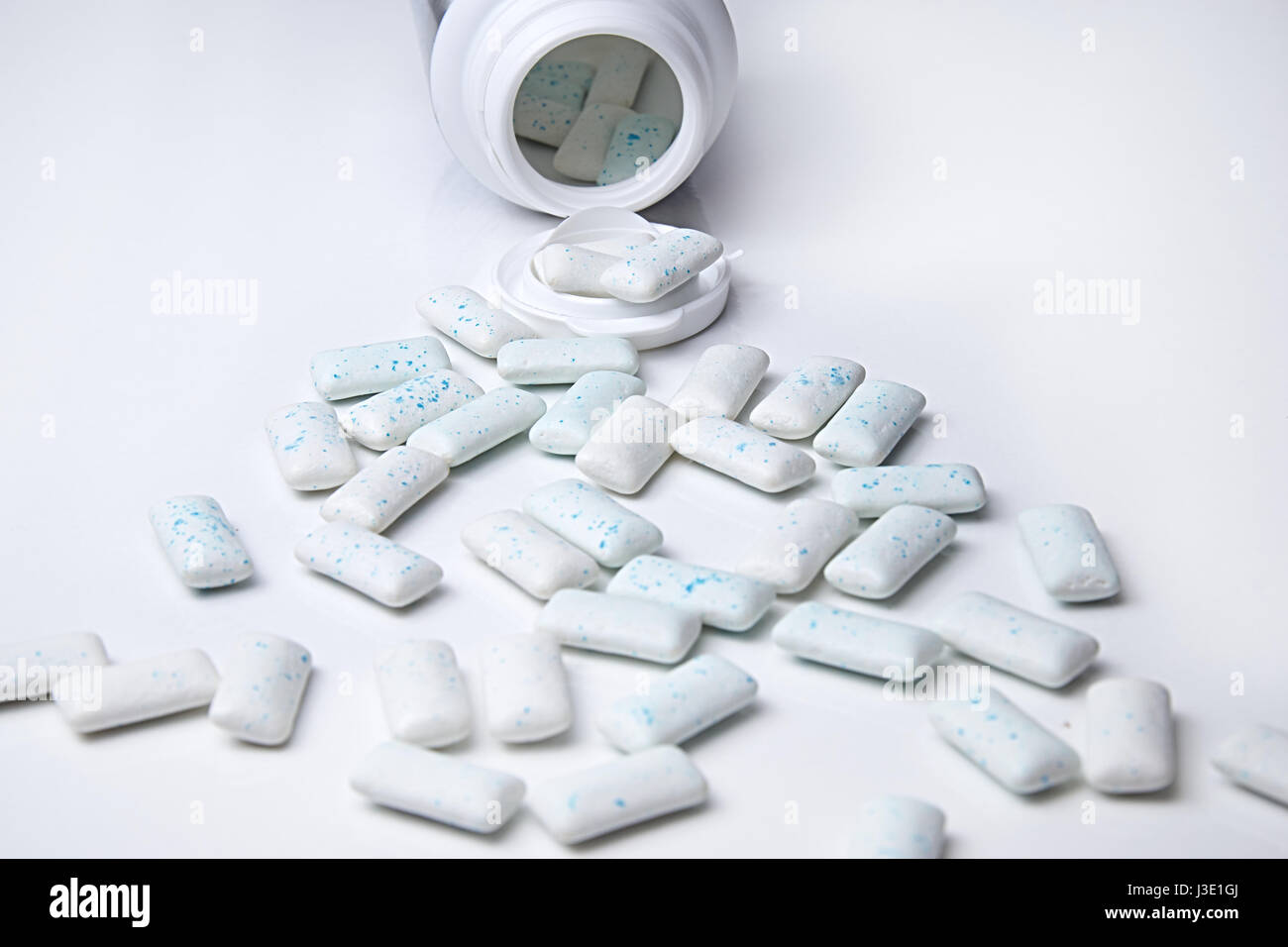 Chewing gum spilled out on white background Stock Photo - Alamy