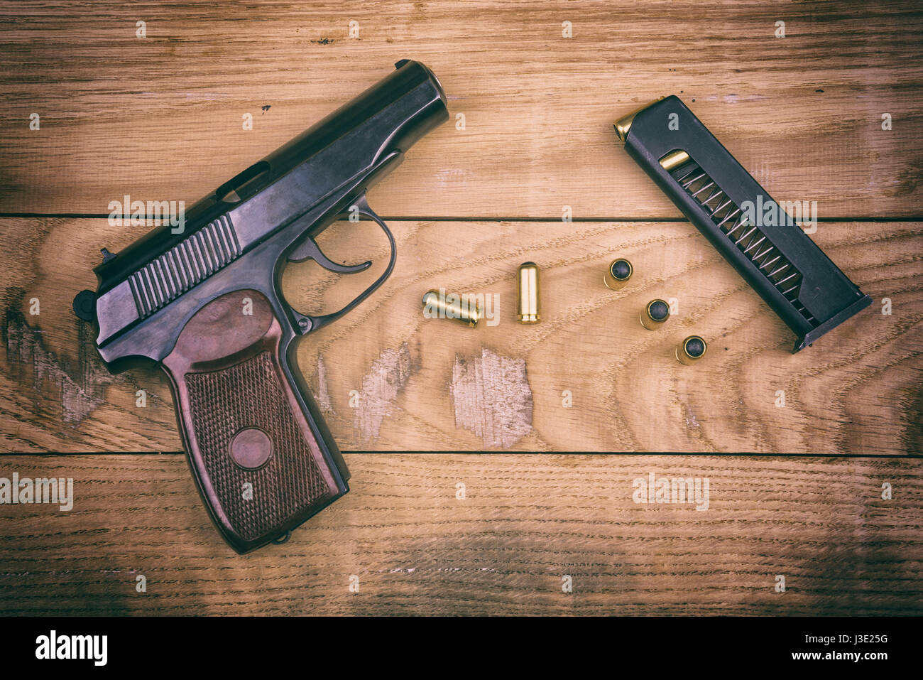 Makarov pistol with bullets on the wooden surface Stock Photo - Alamy