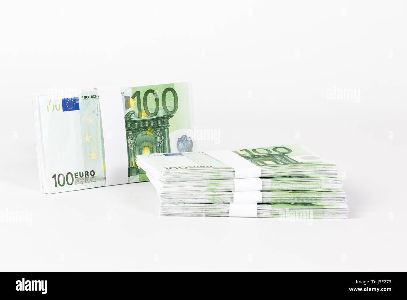 Stacks of 100 Euro Banknotes isolated on white background Stock Photo ...