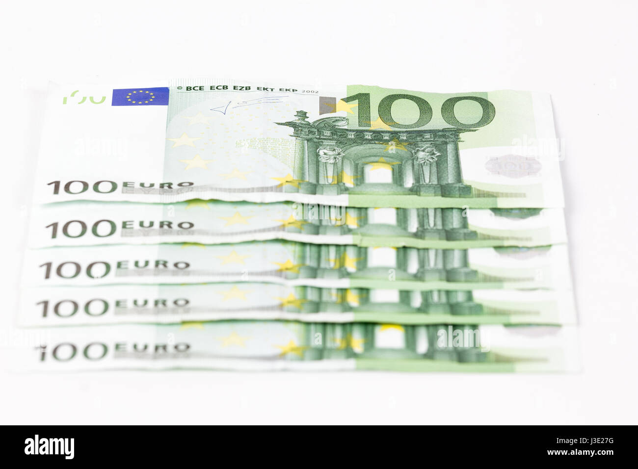 One hundred euro banknotes on white background Stock Photo - Alamy