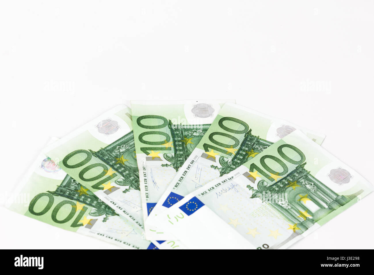 One hundred euro banknotes on white background Stock Photo - Alamy