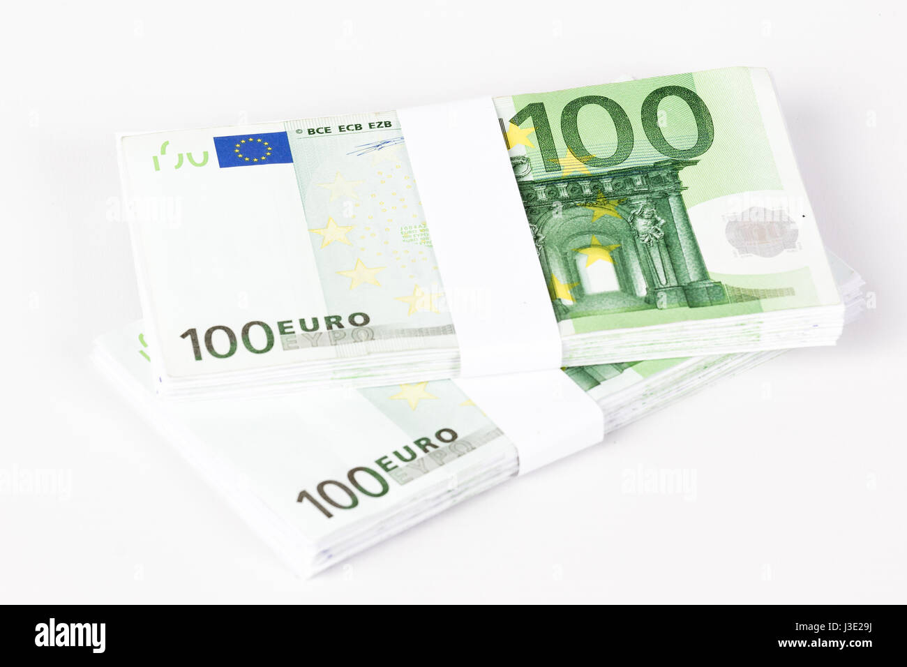 Stacks of 100 Euro Banknotes isolated on white background Stock Photo ...