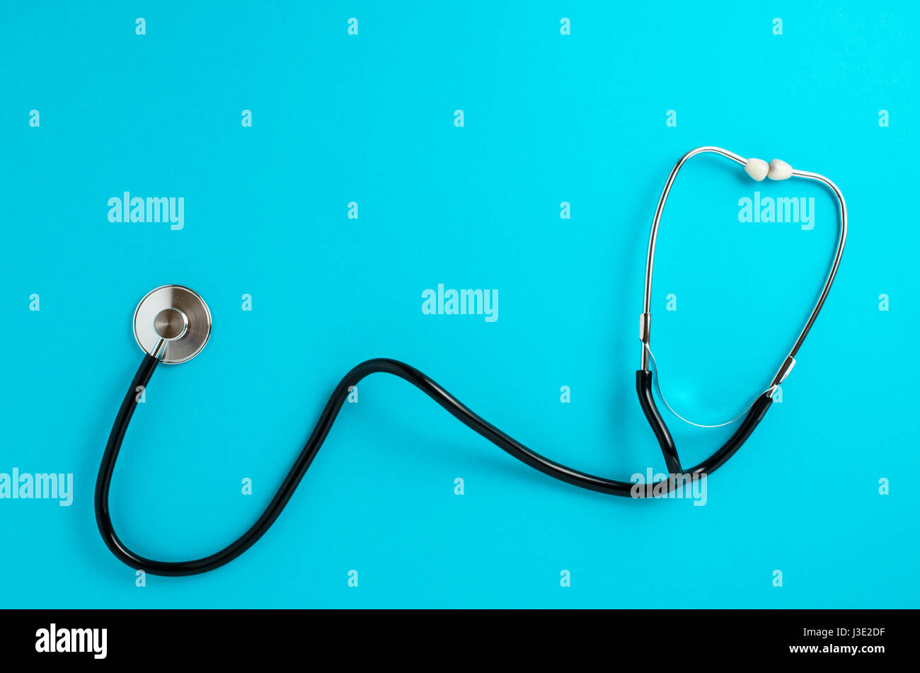 Stethoscope on blue background Stock Photo - Alamy