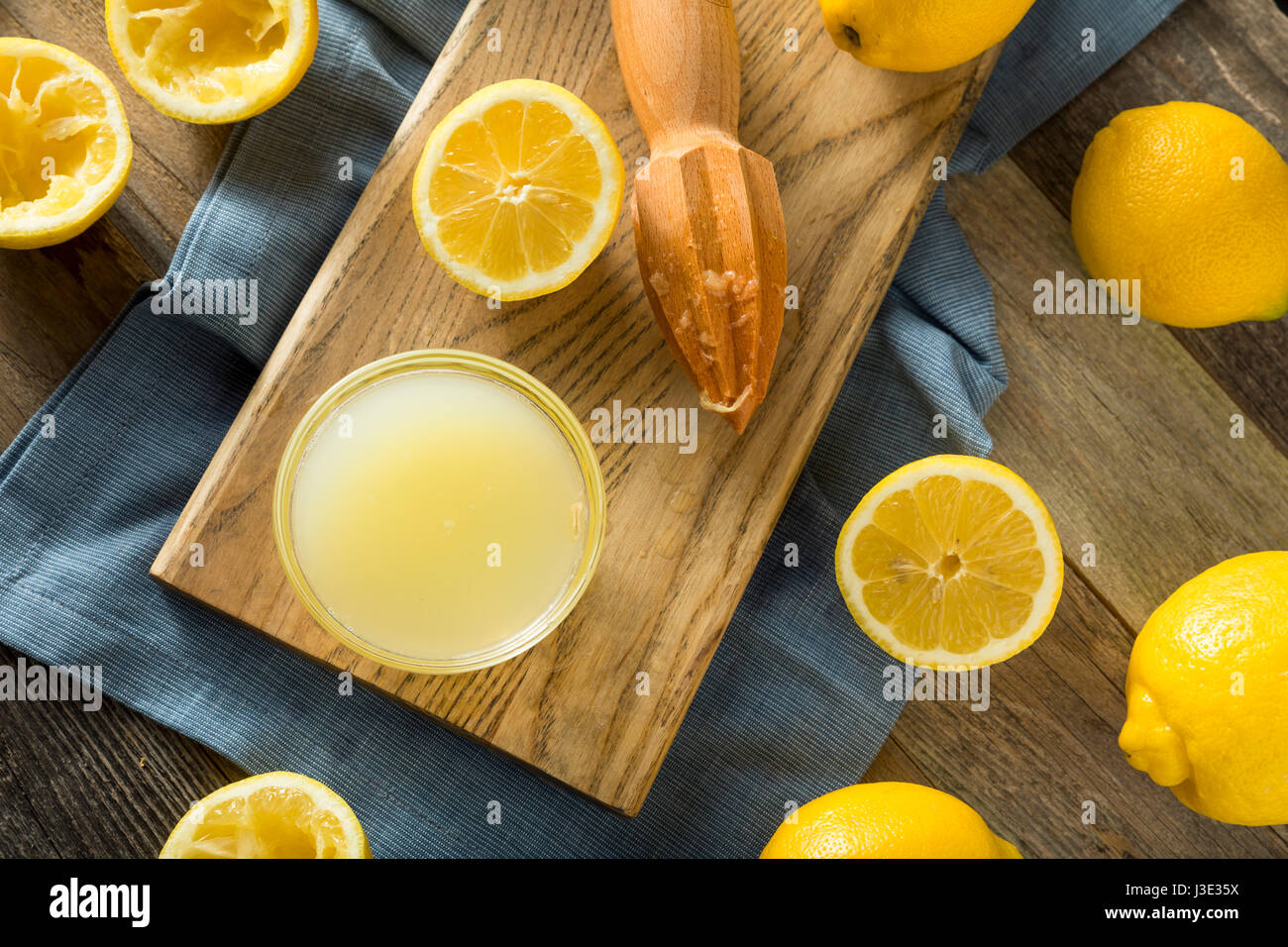 Raw Organic Yellow Lemon Juice in a Bowl Stock Photo - Alamy
