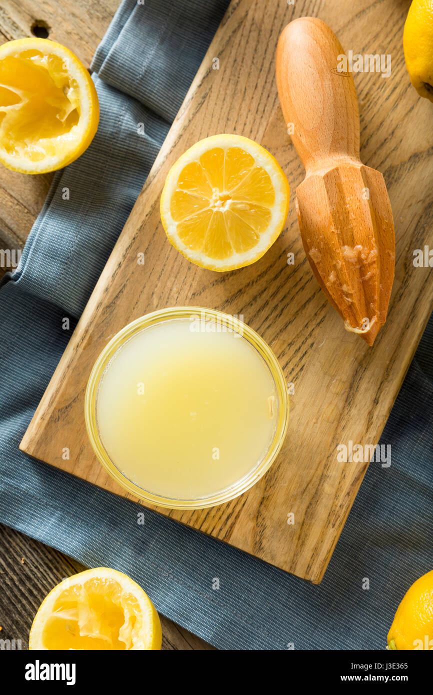 Raw Organic Yellow Lemon Juice in a Bowl Stock Photo - Alamy