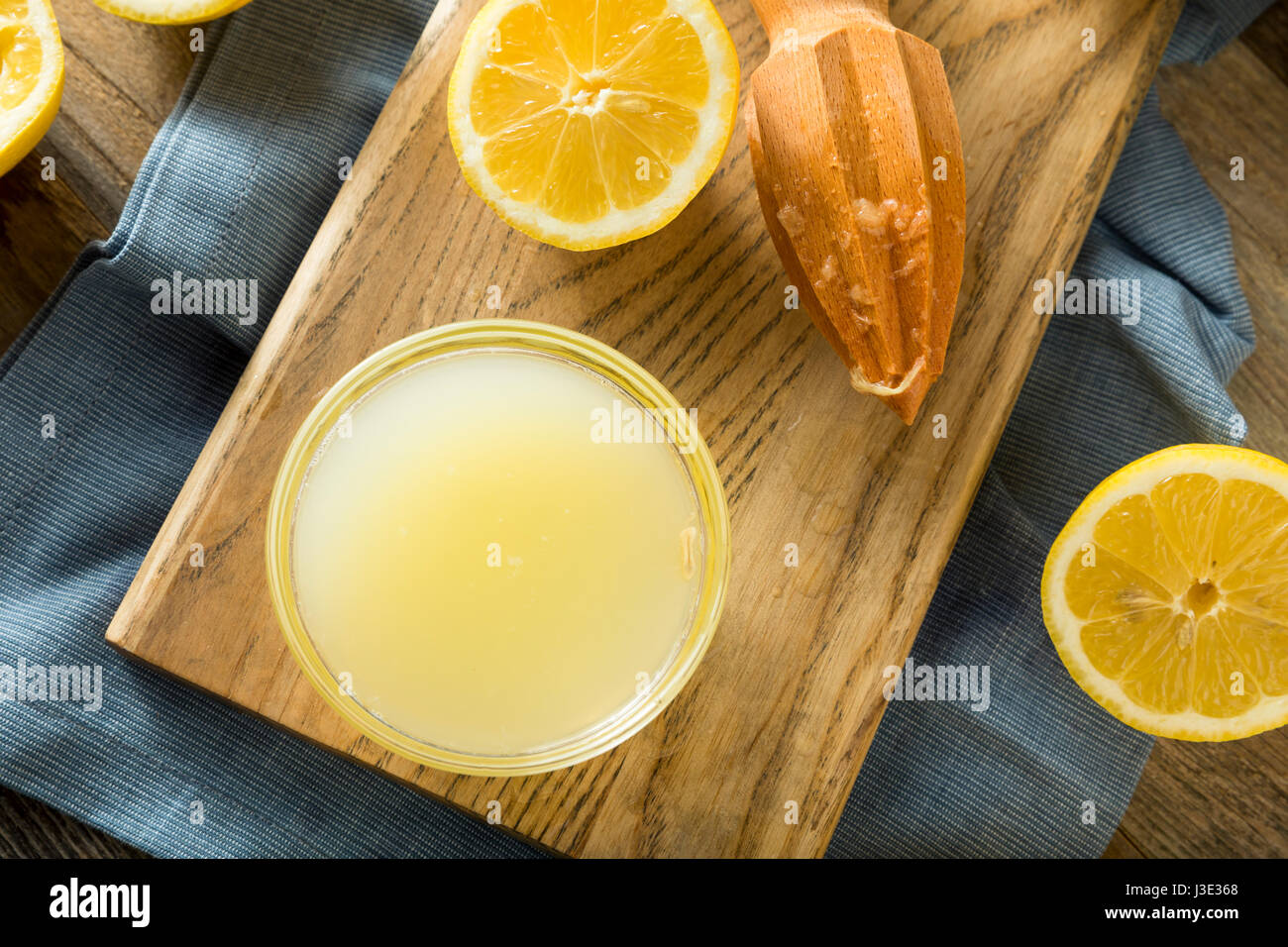 Raw Organic Yellow Lemon Juice in a Bowl Stock Photo - Alamy