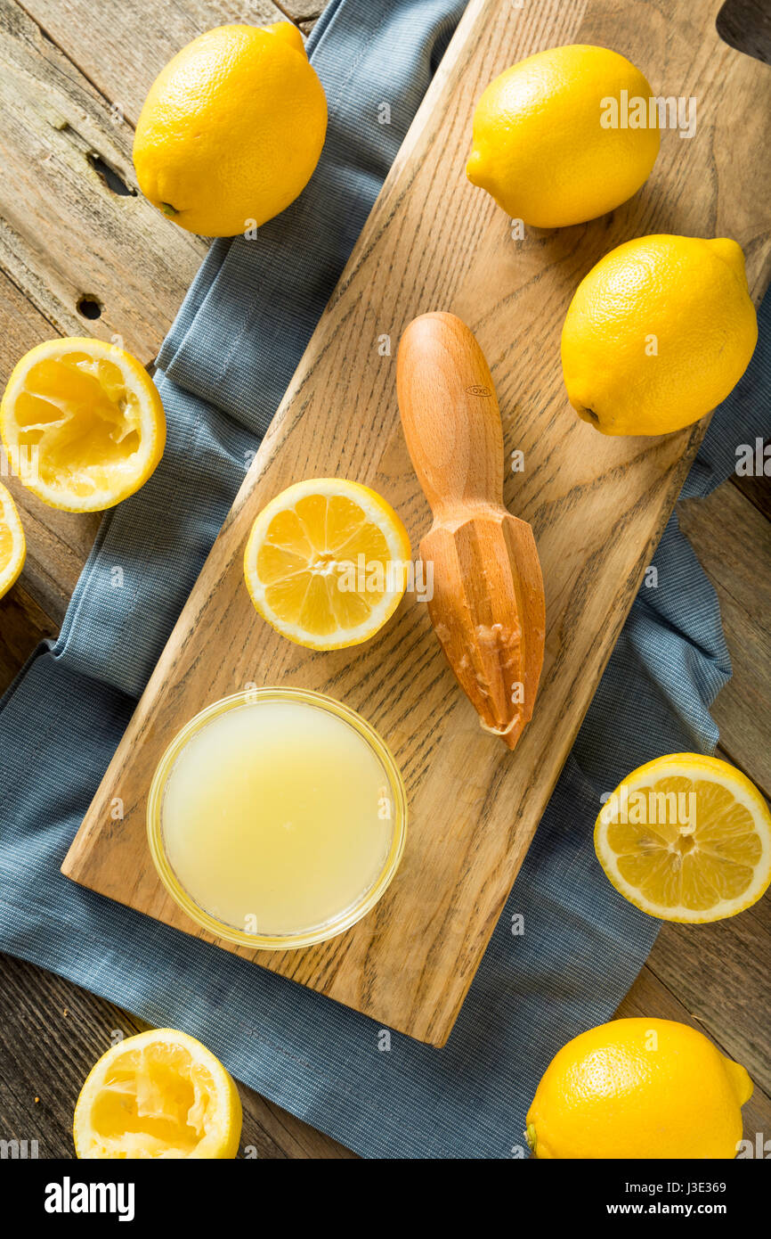 Raw Organic Yellow Lemon Juice in a Bowl Stock Photo - Alamy