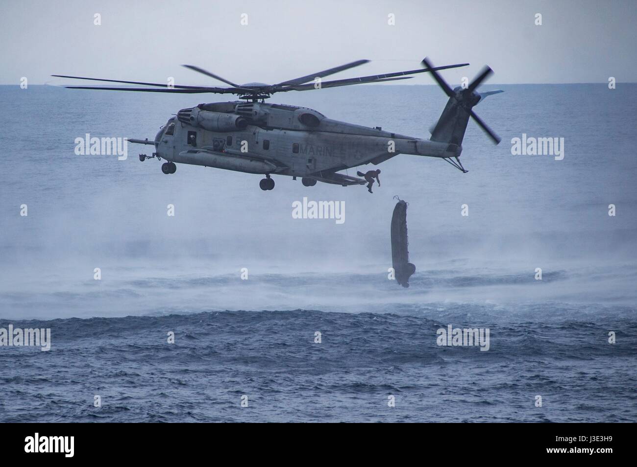 U.S. Marine special forces drop an inflatable commando boat and jump ...