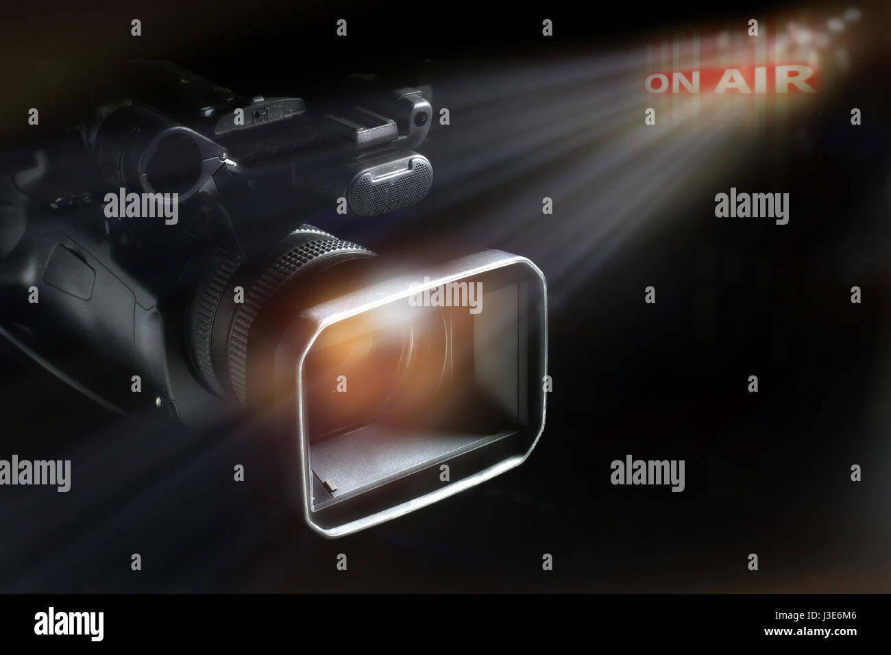 professional video camcorder in studio with on-air light background ...