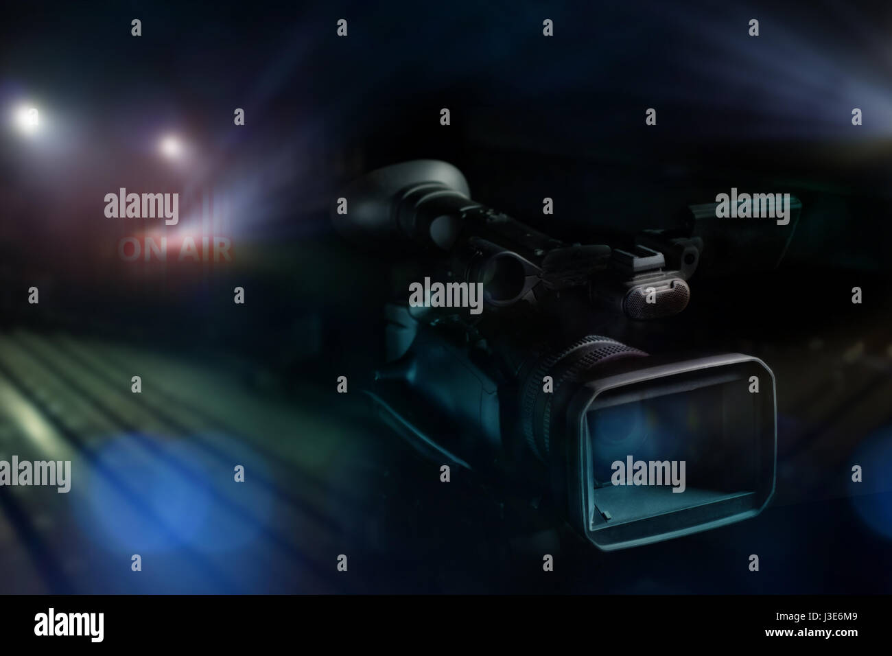 professional video camcorder in studio with on-air light background ...