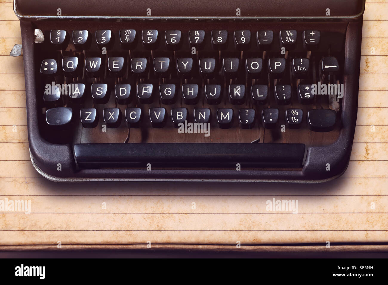 Keyboard on a vintage typewriter on paper background Stock Photo - Alamy