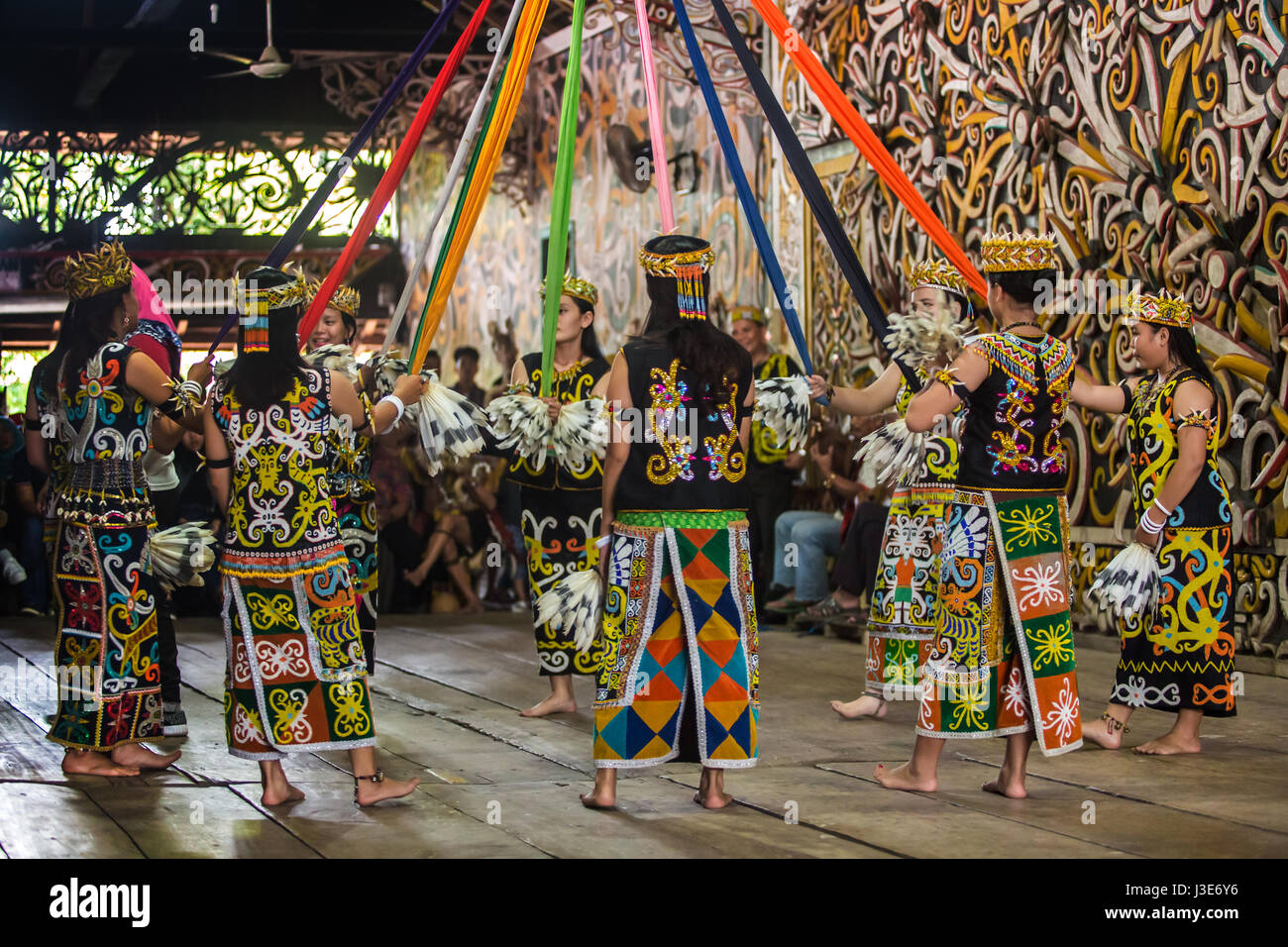 Dayak girls performing Cultural Dance in colorful traditional costume ...